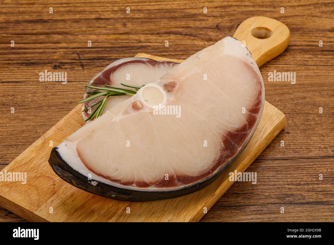 Raw shark steak served rosemary for cooking Stock Photo - Alamy