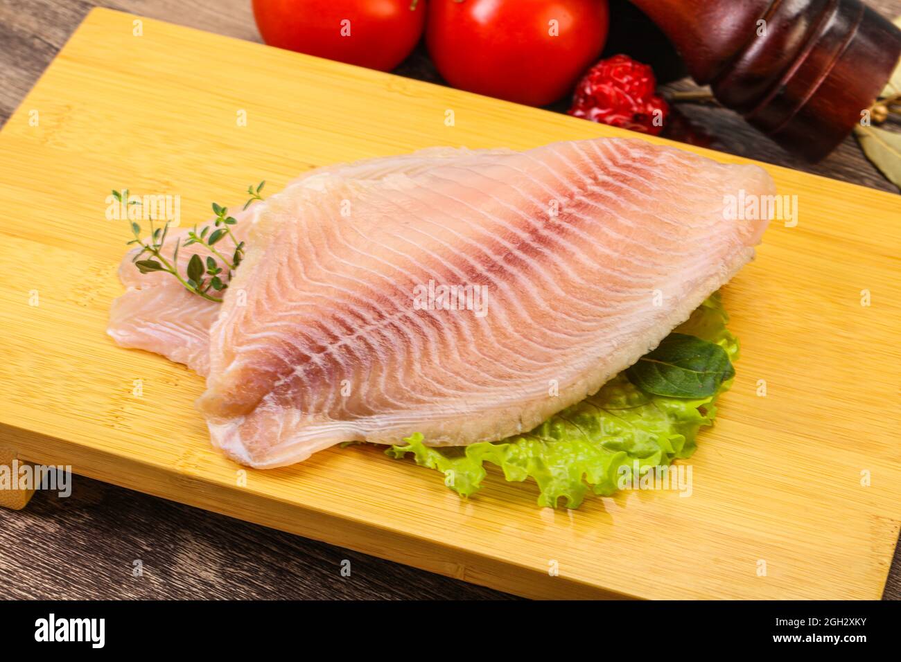 Raw tilapia fish fillet for cooking Stock Photo - Alamy