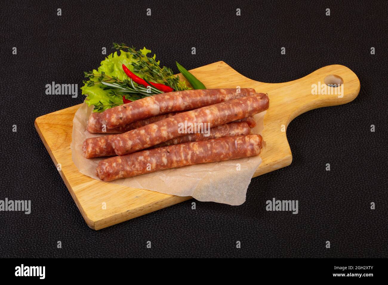 Raw pork sausages for grill Stock Photo - Alamy