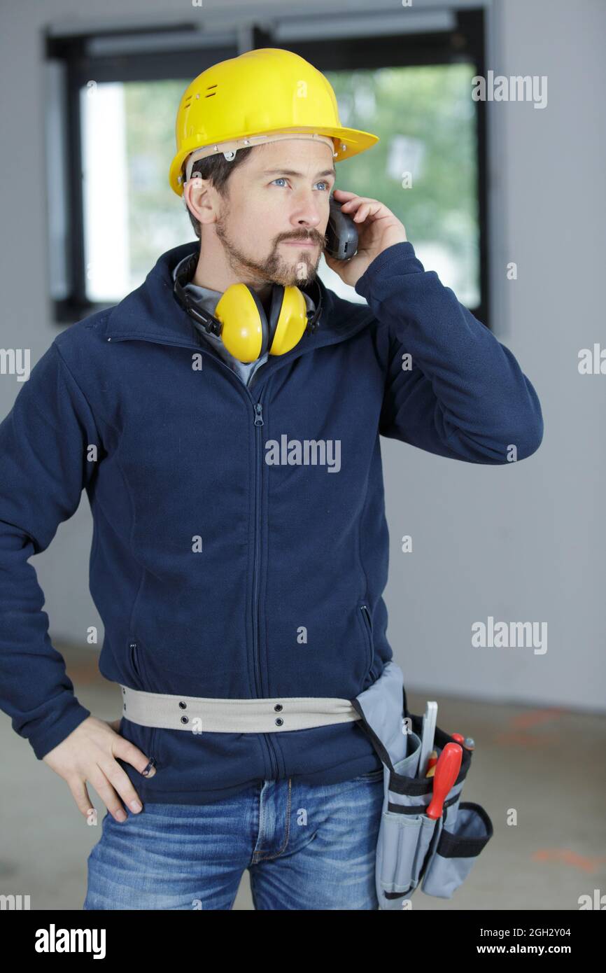 Young handsome contractor working hi-res stock photography and images ...