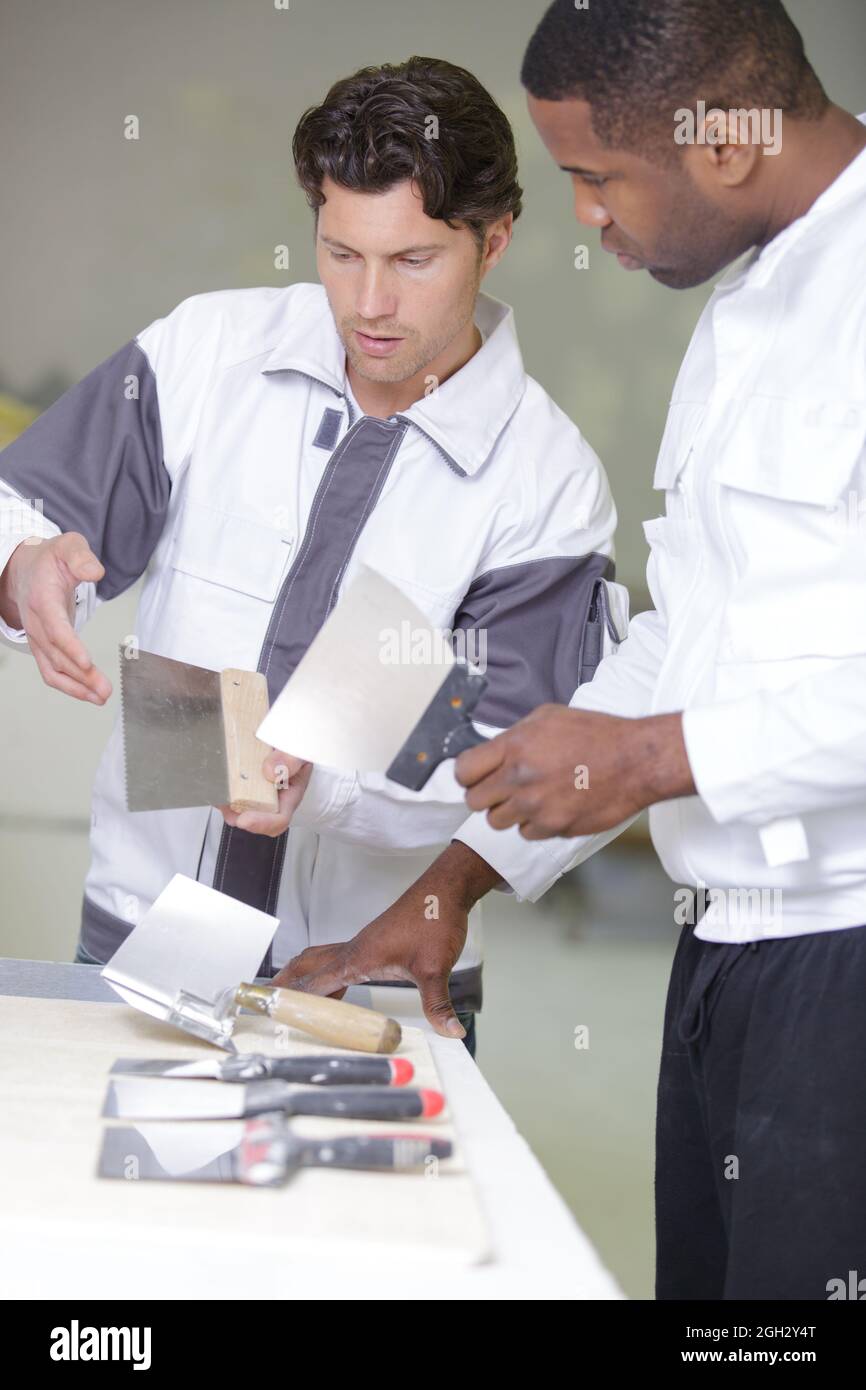 building repair teamwork and people concept Stock Photo - Alamy
