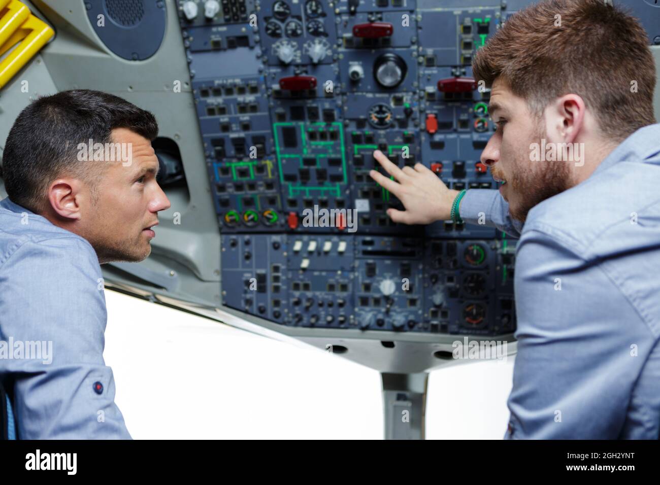 two males in the cockpit discussing about the commands Stock Photo - Alamy