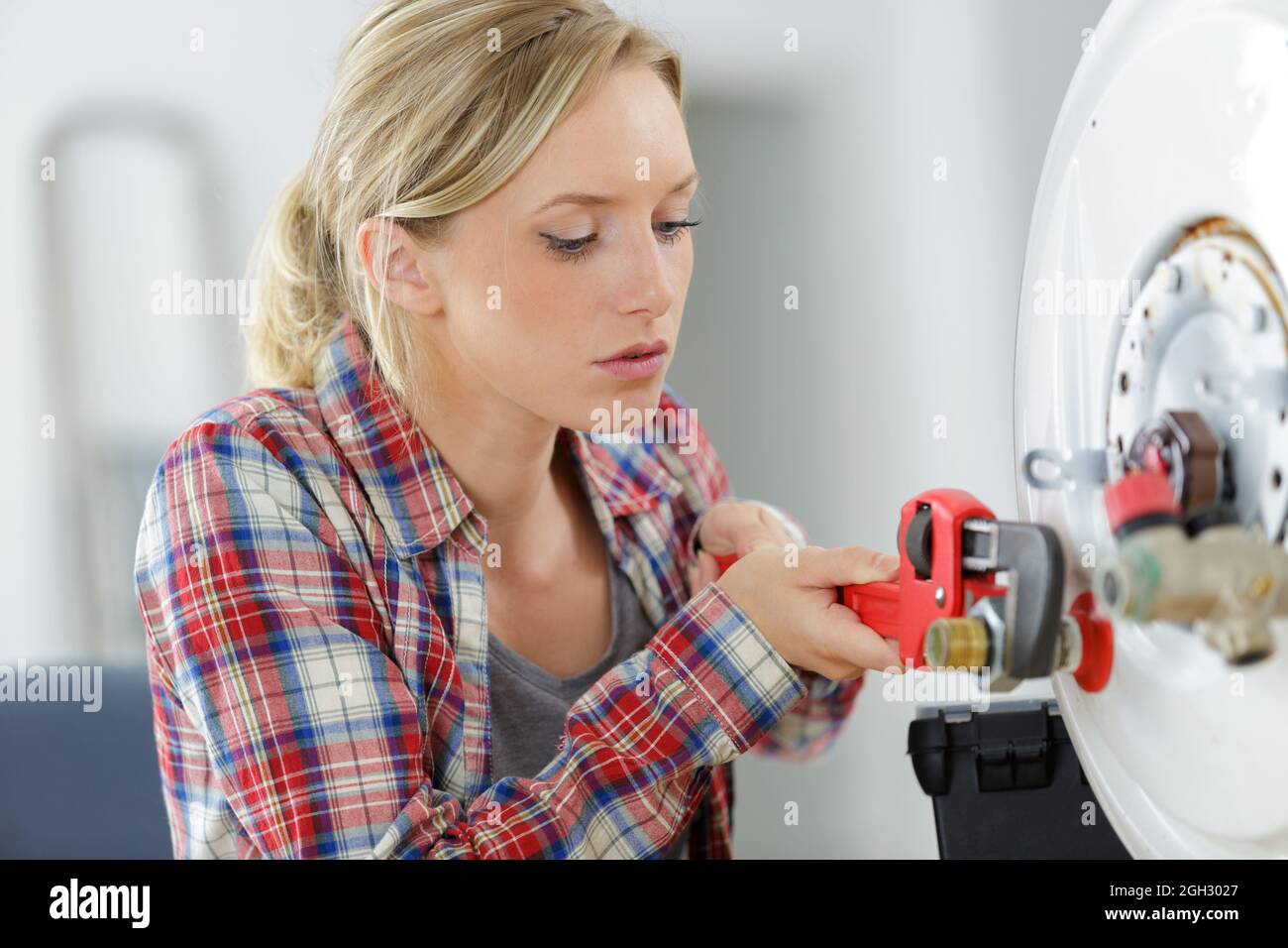 engineer checking boiler at work Stock Photo - Alamy