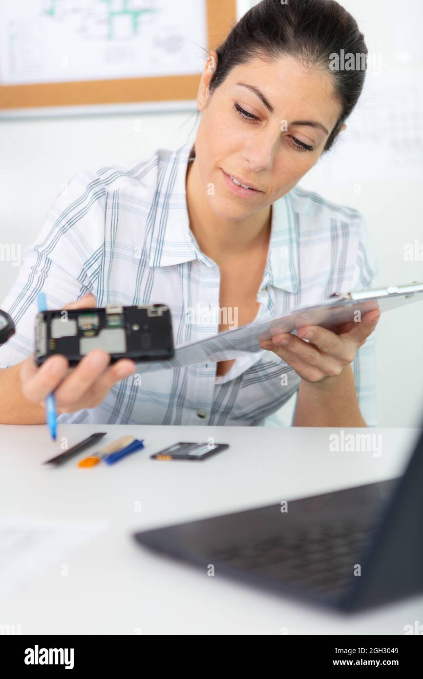 engineer woman repairing computer part Stock Photo - Alamy
