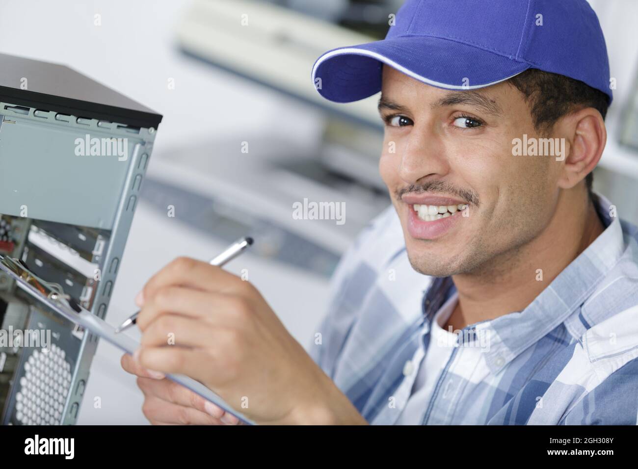 male technician during professional computer service Stock Photo - Alamy