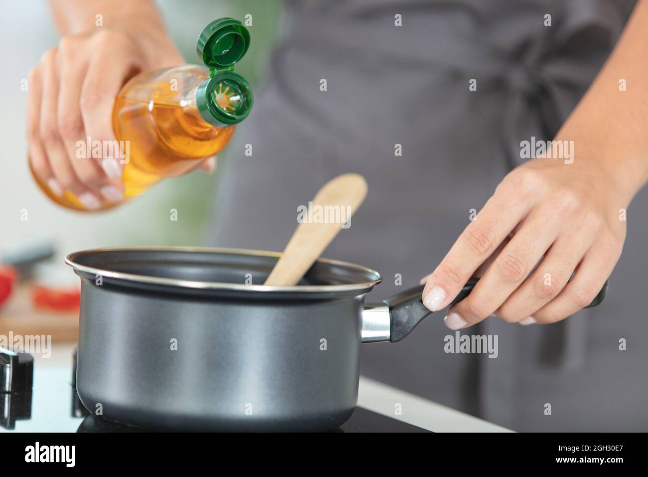 Man pouring cooking oil frying hi-res stock photography and images - Alamy