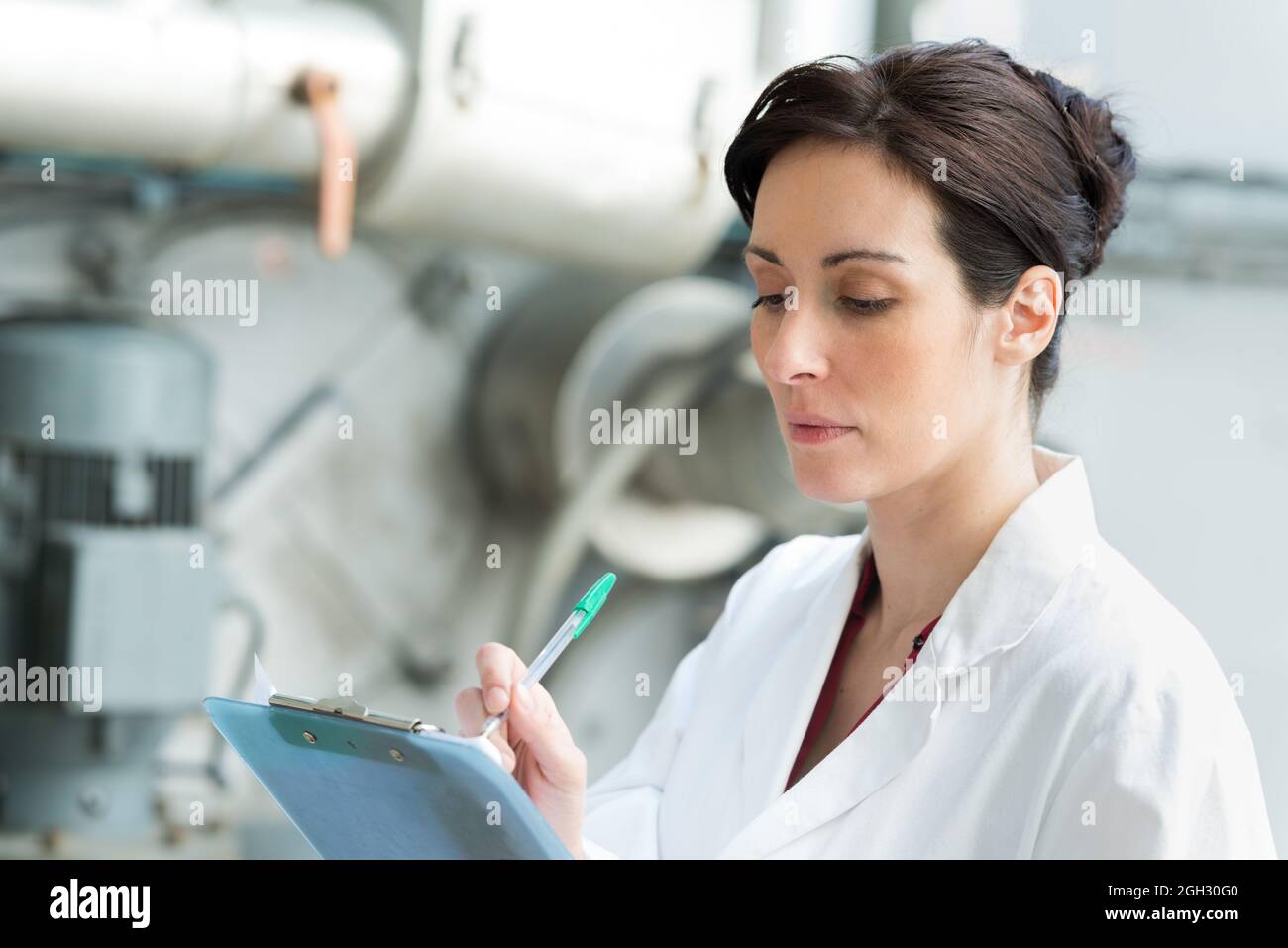 female worker in factory en inspection quality control Stock Photo - Alamy