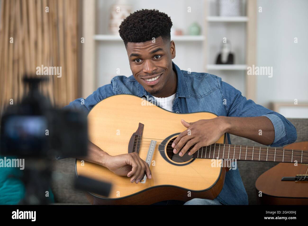 male vlogger recording music related broadcast at home Stock Photo - Alamy
