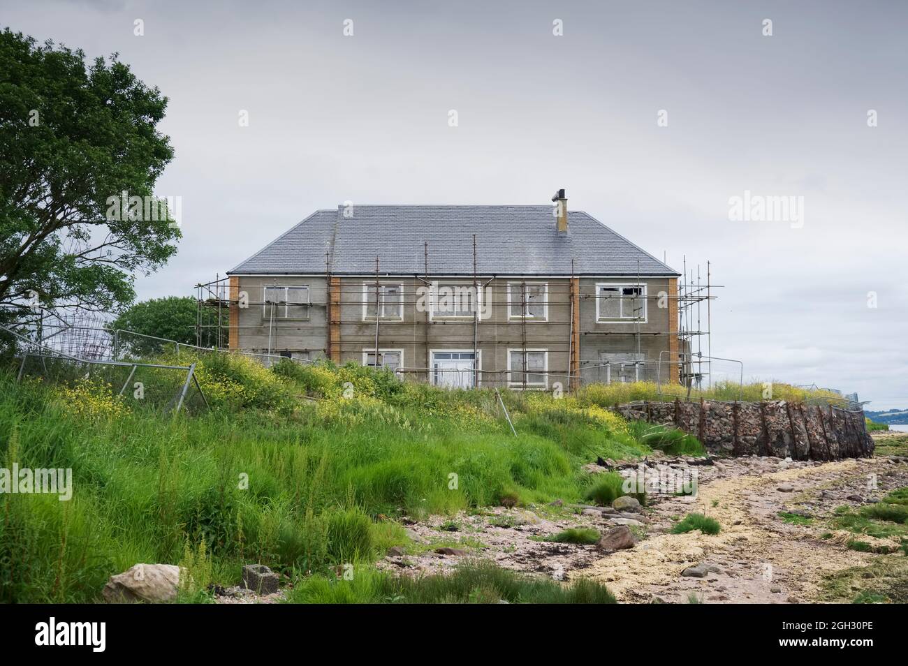 Derelict council house in poor housing area at coastal location Stock ...