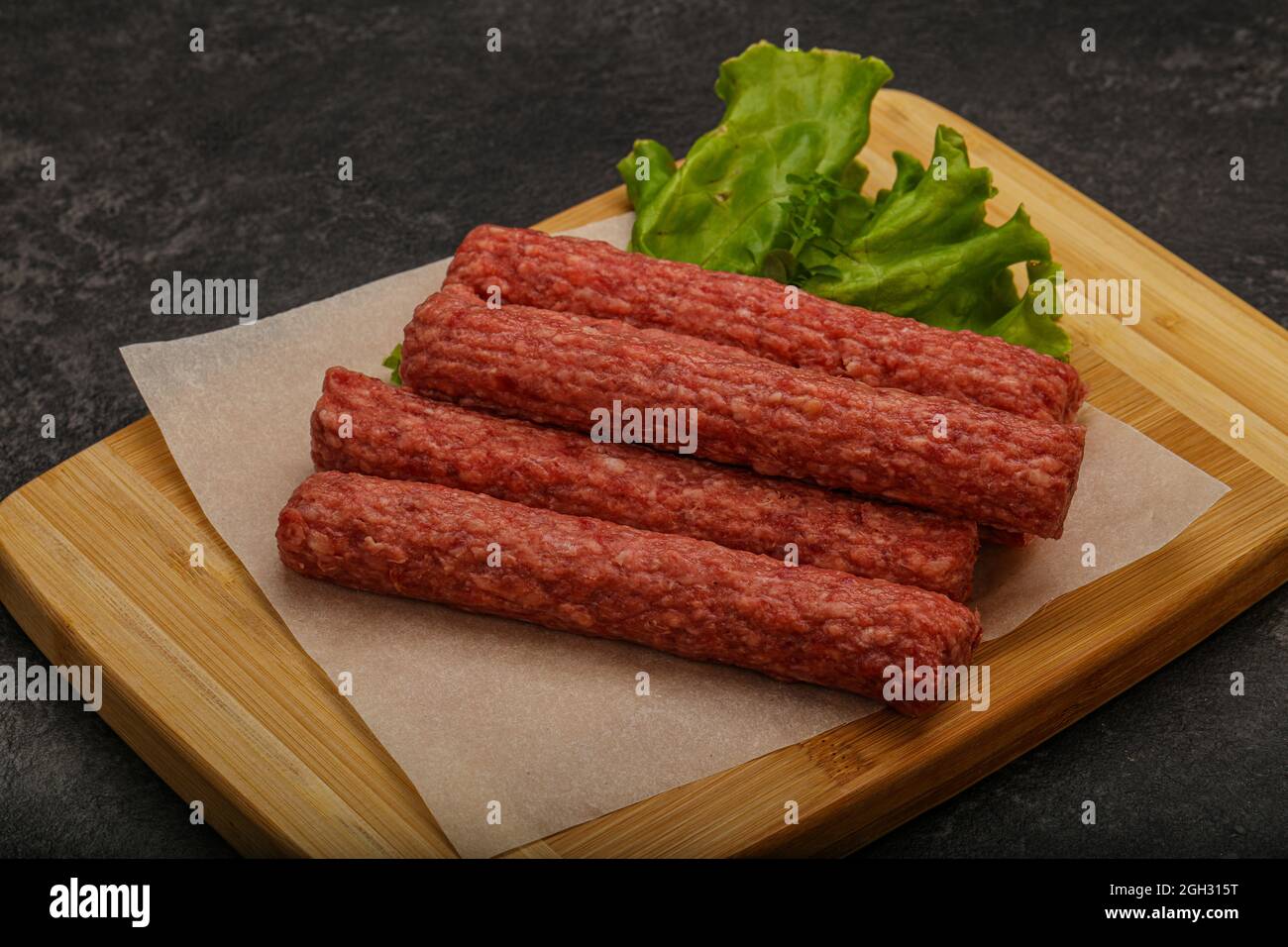 Raw beef sausages with spices for grill Stock Photo - Alamy