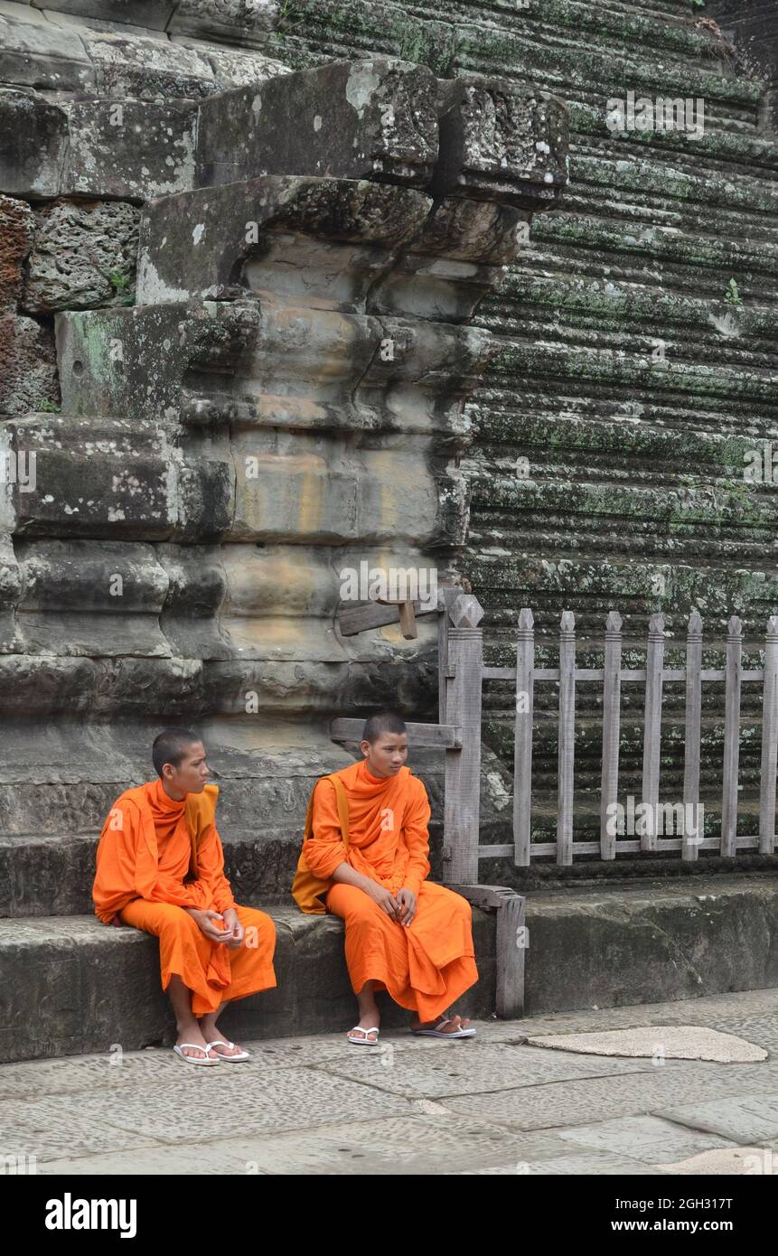 ANKOR WAT, CAMBODIA - Jul 24, 2021: A vertical shot of young monks ...