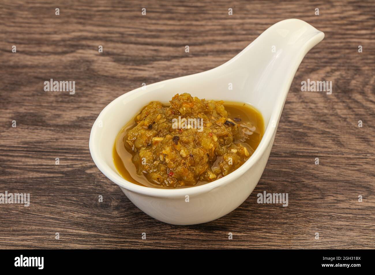 Green spicy sauce with pepper in the bowl Stock Photo - Alamy