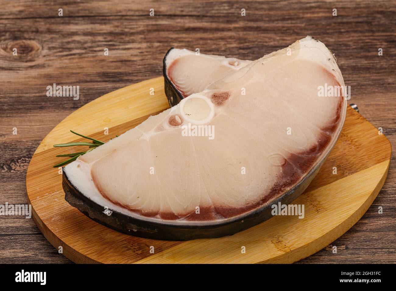 Raw shark steak served rosemary for cooking Stock Photo - Alamy