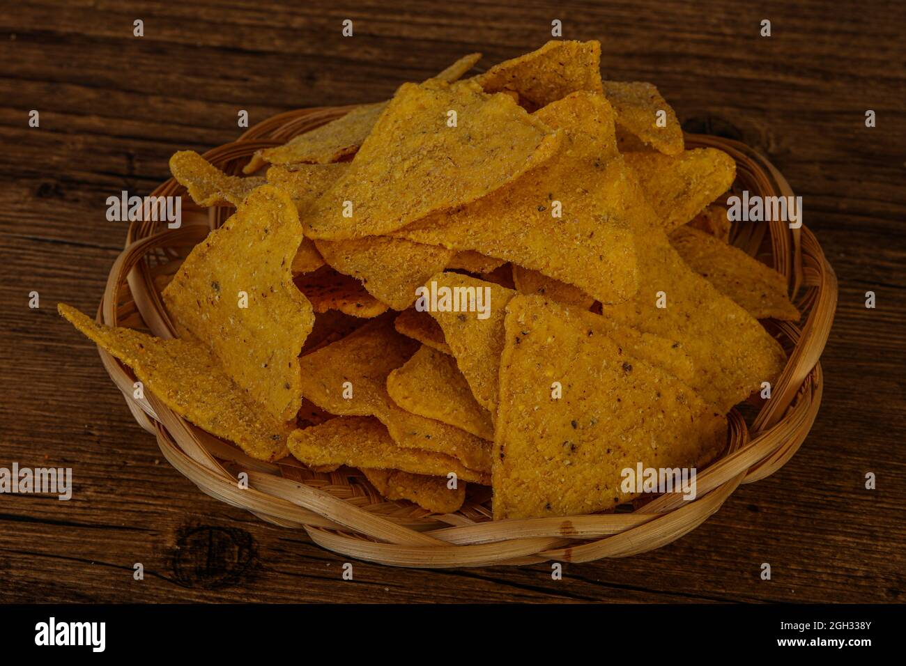 Mexican crunchy corn nachos triangle heap Stock Photo - Alamy