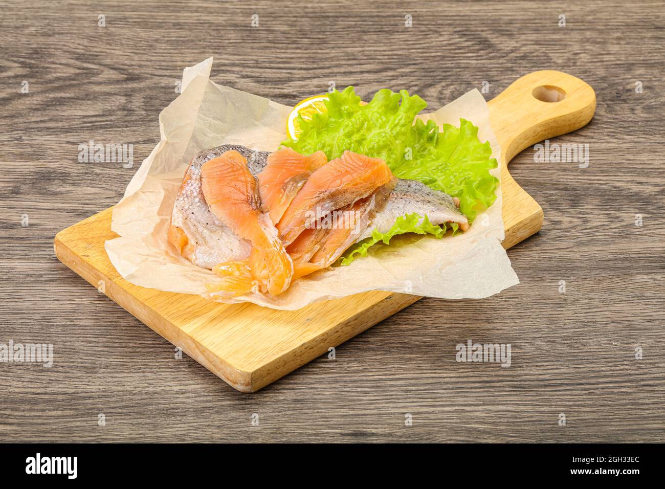 Sliced natural wild trout fillet over board Stock Photo - Alamy