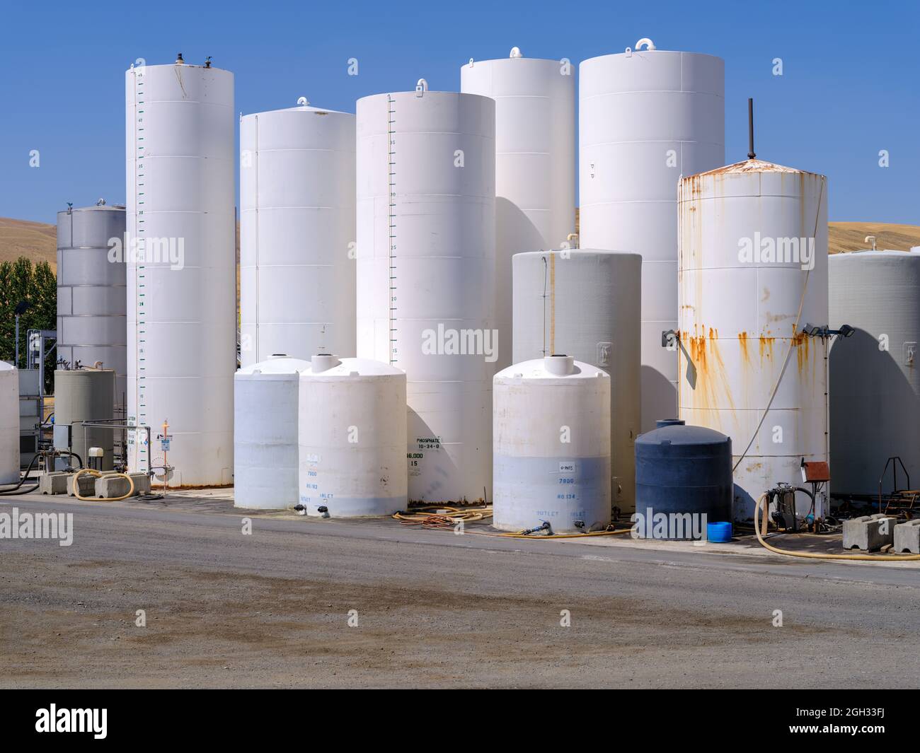 Tall white Phosphate storage tanks at the Port of Central Ferry ...