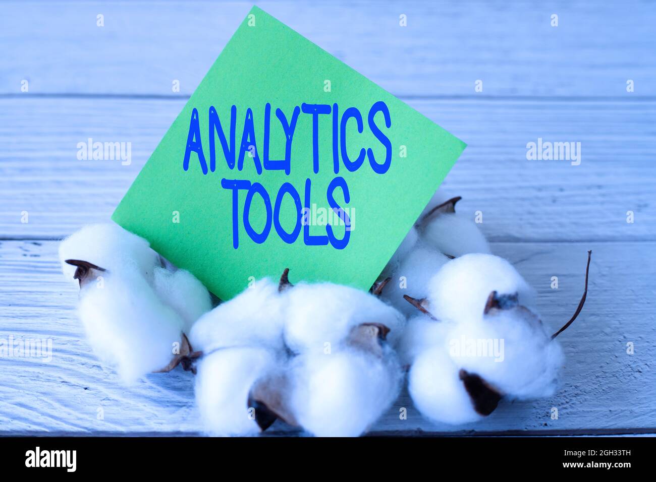 Hand writing sign Analytics Tools. Internet Concept pieces of web application analysis software ...