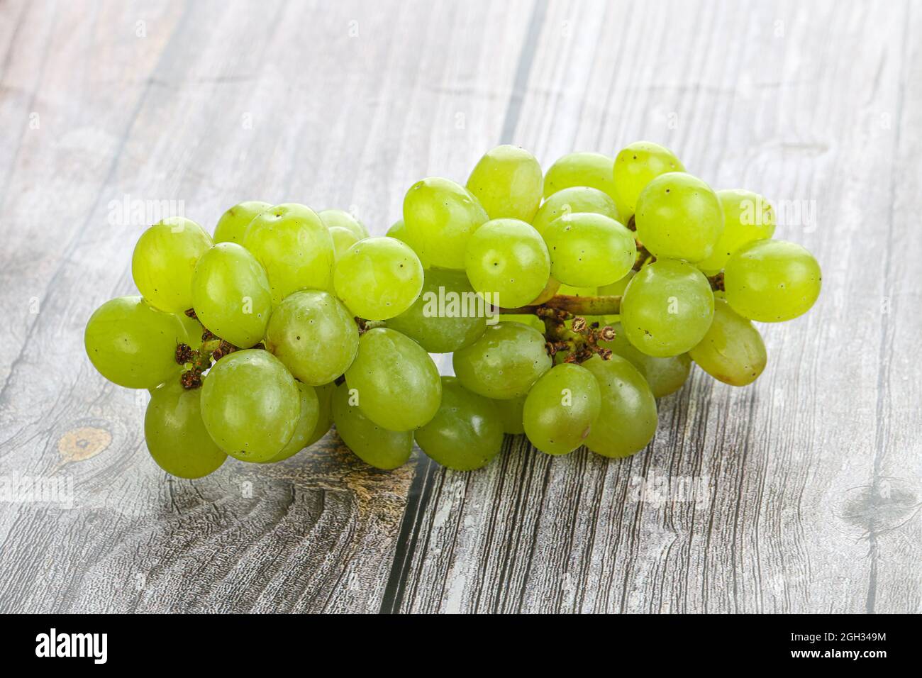 Ripe sweet green grape branch isolated Stock Photo - Alamy