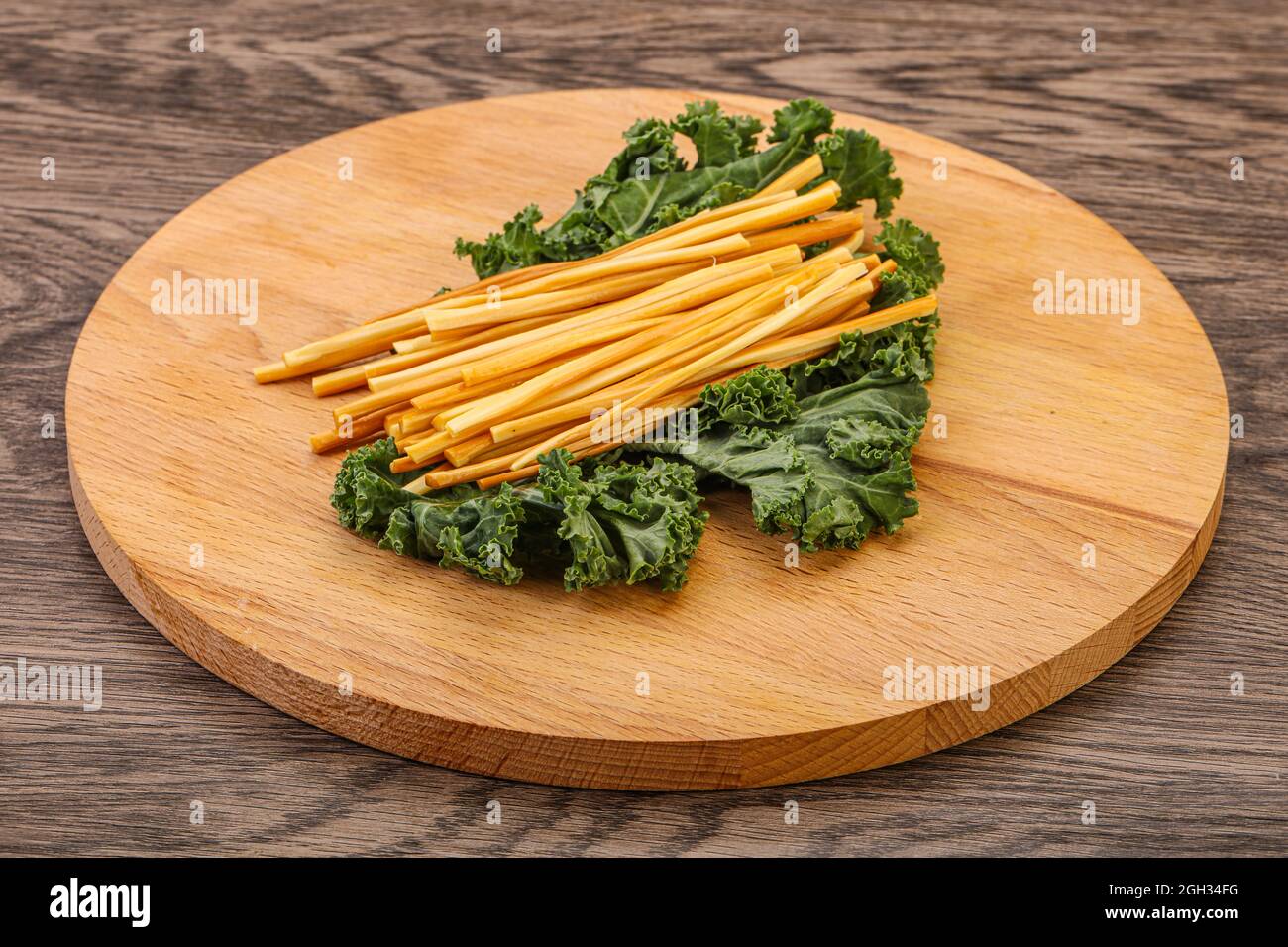 Caucasian Chechel cheese sticks over board Stock Photo - Alamy