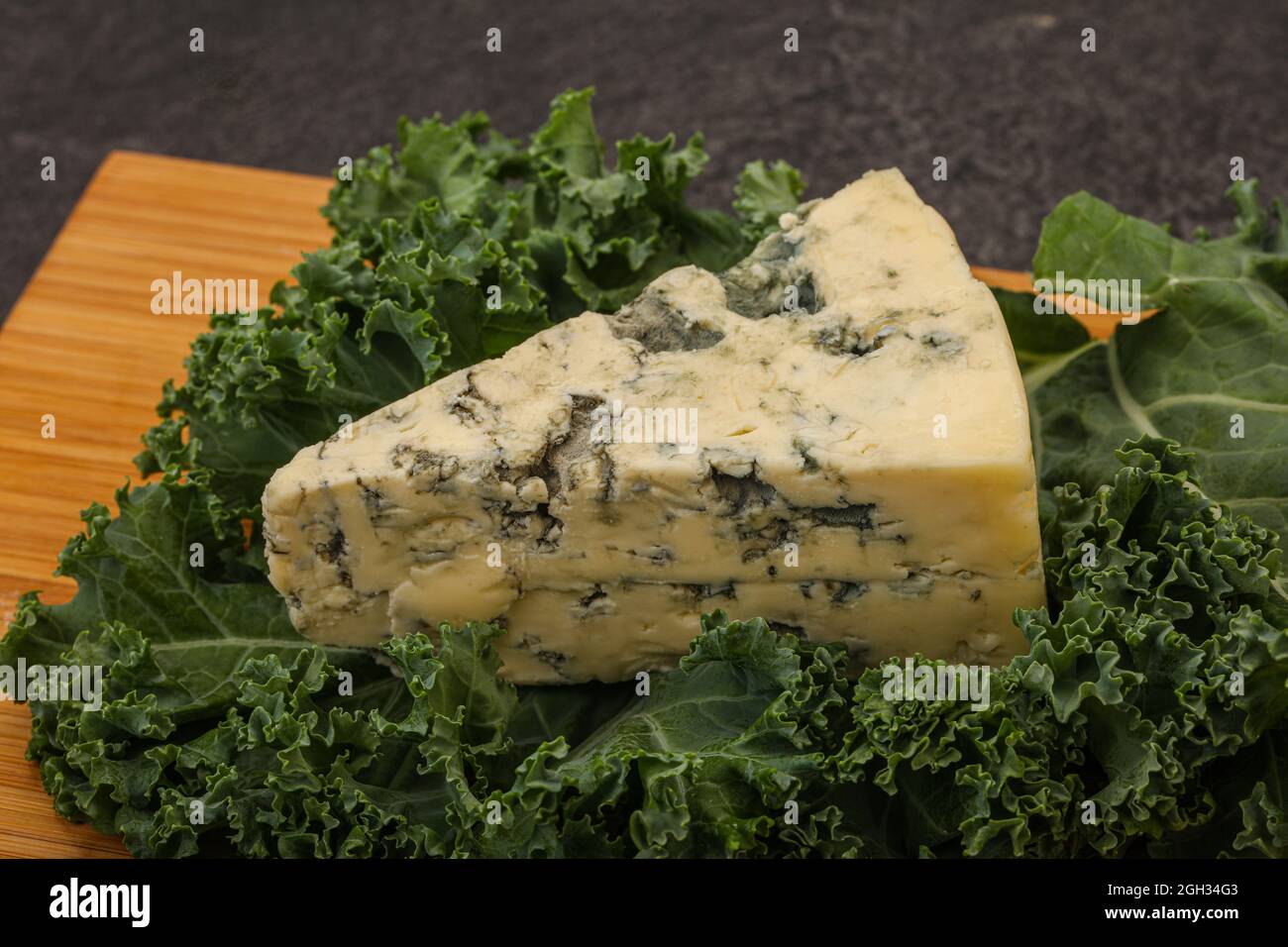 Dairy Blue cheese triangle with mold Stock Photo - Alamy