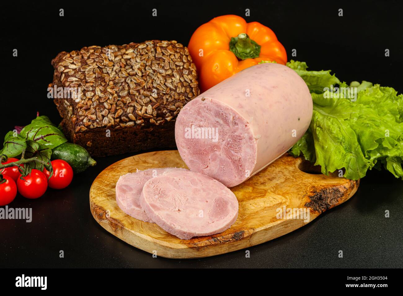 Delicous Pork ham sausage cut isolated Stock Photo - Alamy