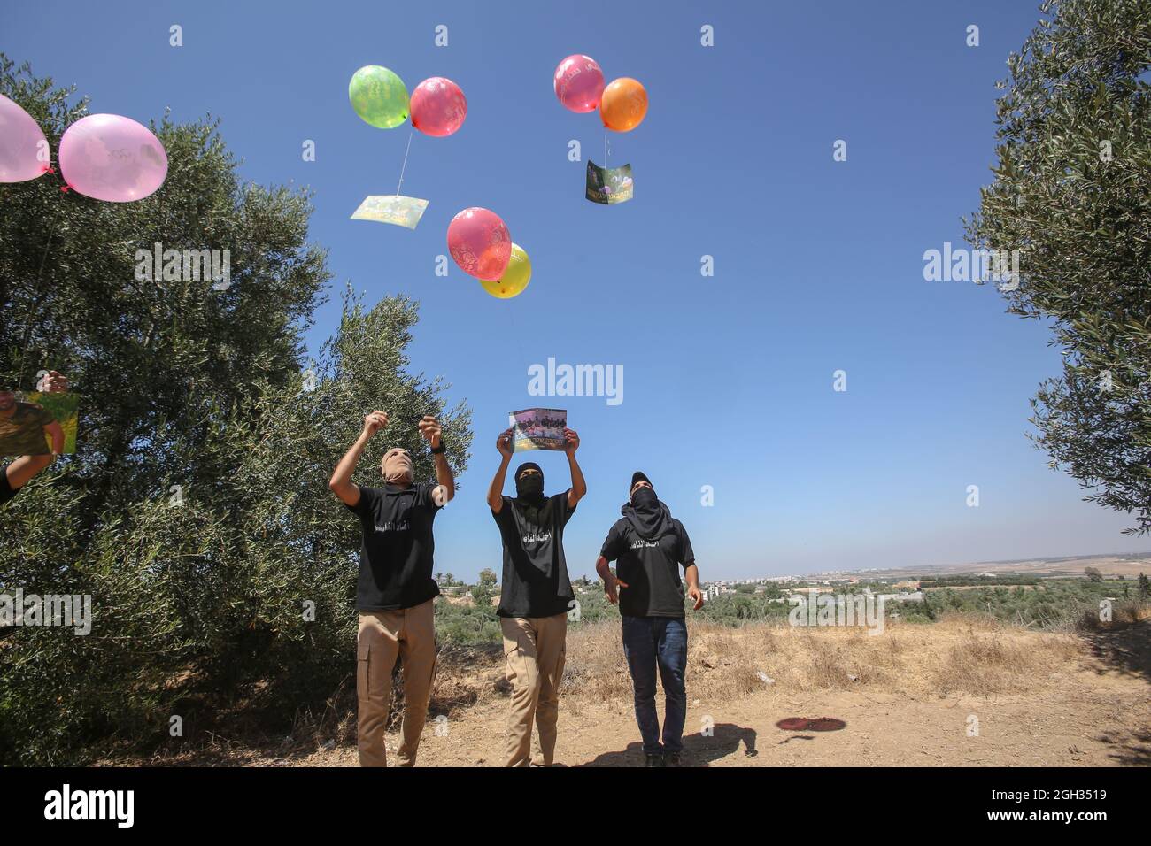 Gaza, Palestine. 04th Sep, 2021. Masked Palestinians launch balloons ...