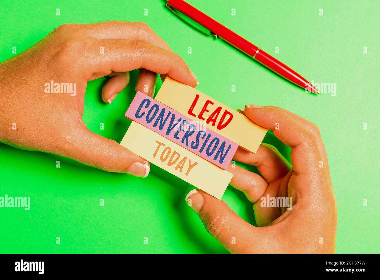 Hand writing sign Lead Conversion. Internet Concept Process of turning ...