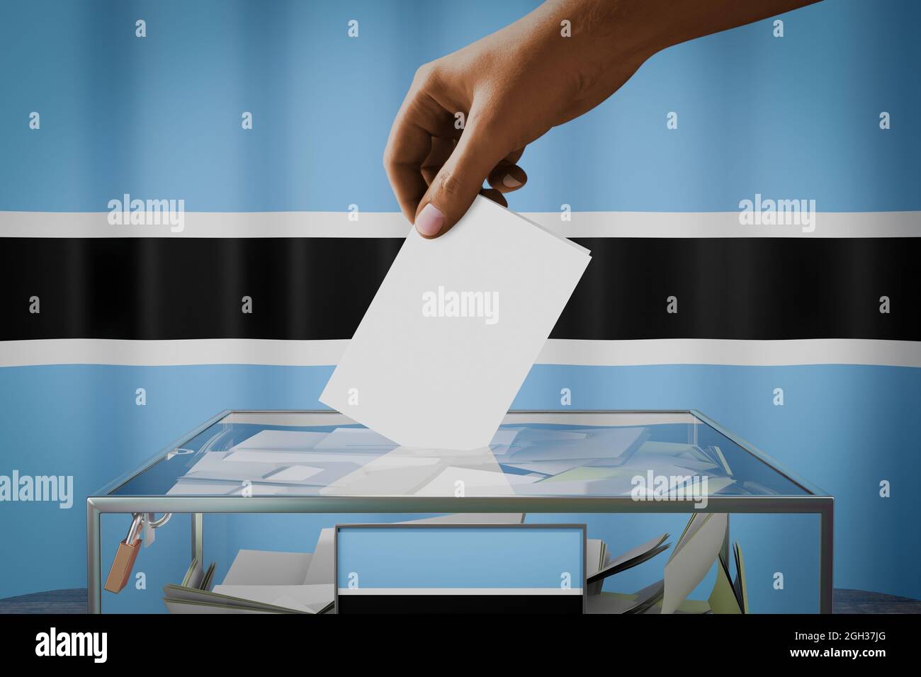 Botswana flag, hand dropping ballot card into a box - voting, election ...