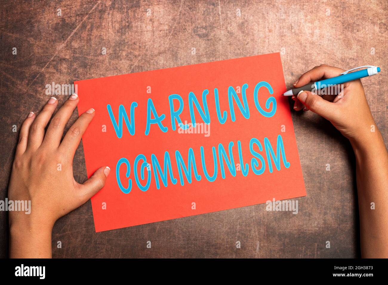 Conceptual caption Warning Communism. Word for economic system where ...