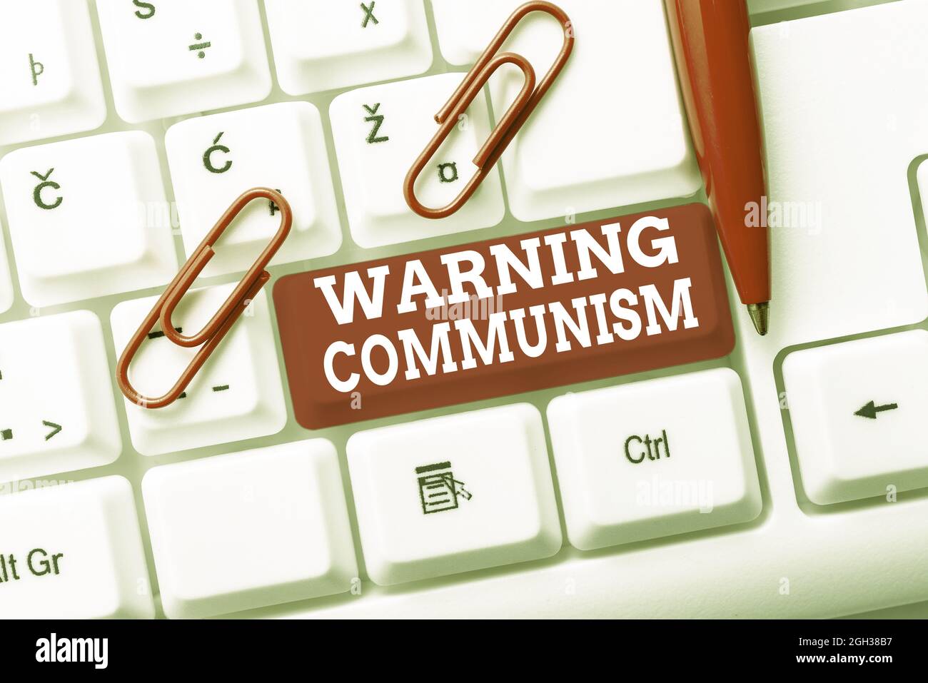 Sign displaying Warning Communism. Word Written on economic system ...