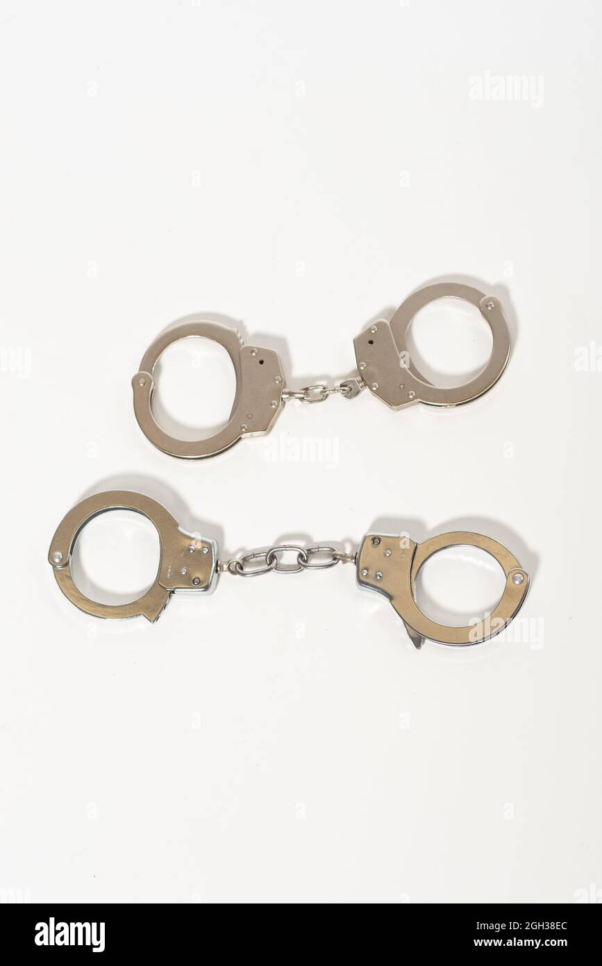 Real handcuffs hi-res stock photography and images - Alamy