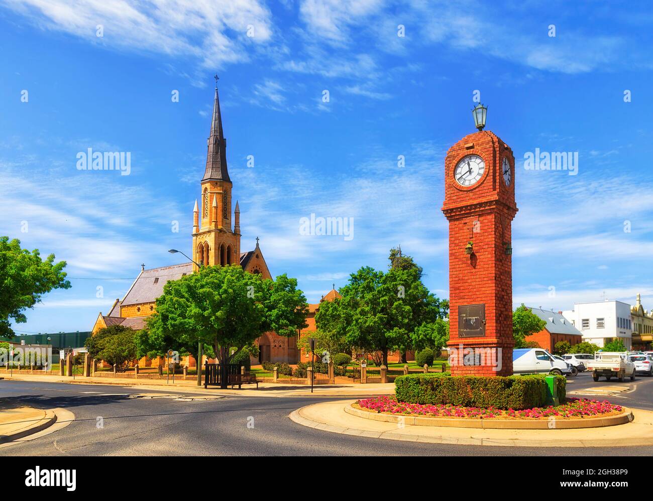 Landmark brick clock tower at intersection in rural regional town ...
