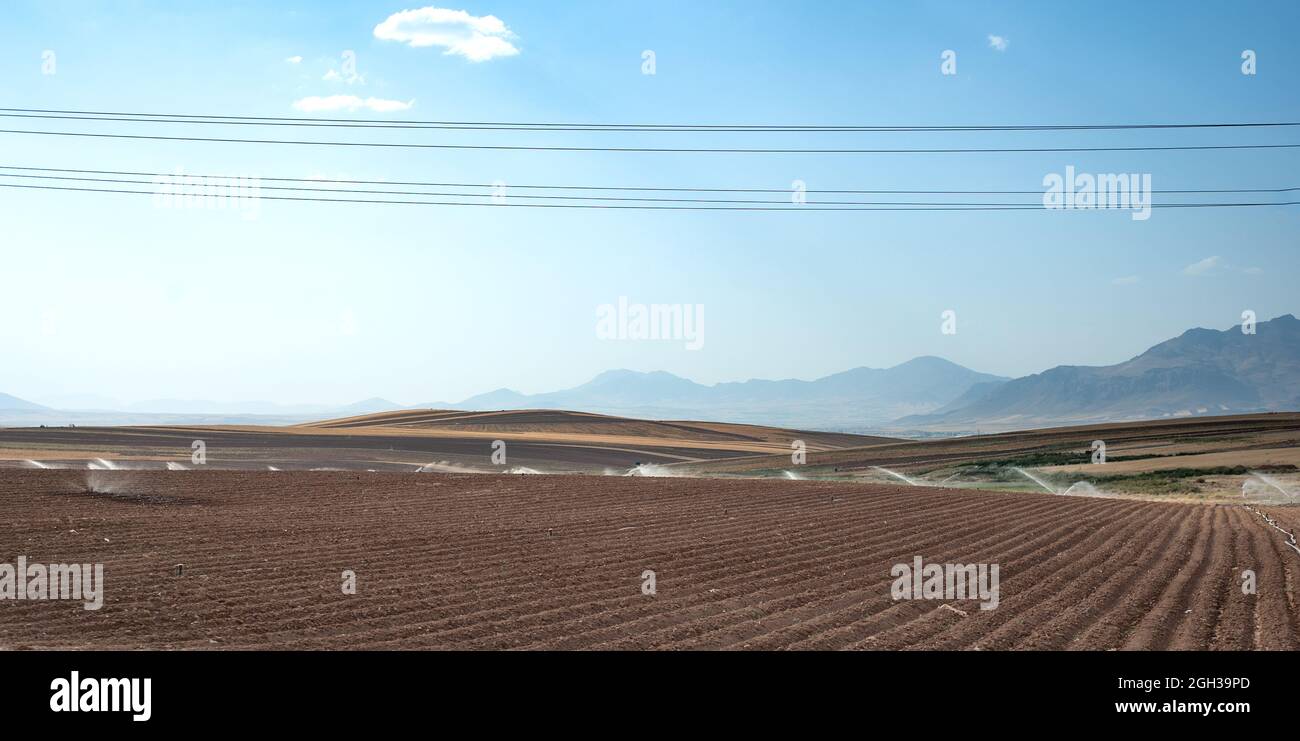 rows of soil before planting. Furrows row pattern in a plowed field ...