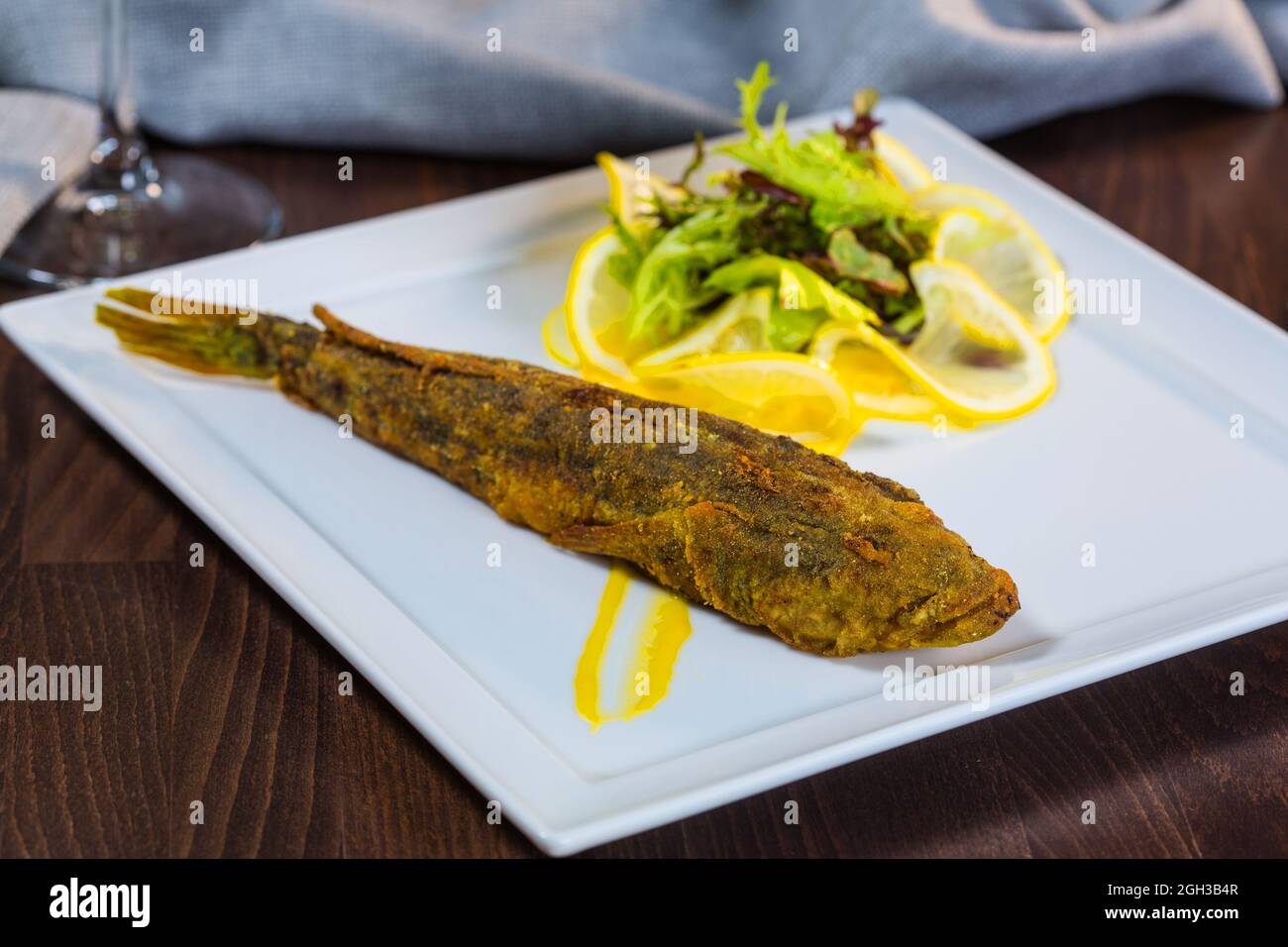 Fried fish. Fish steers. Fish fried in flour with garnish Stock Photo ...