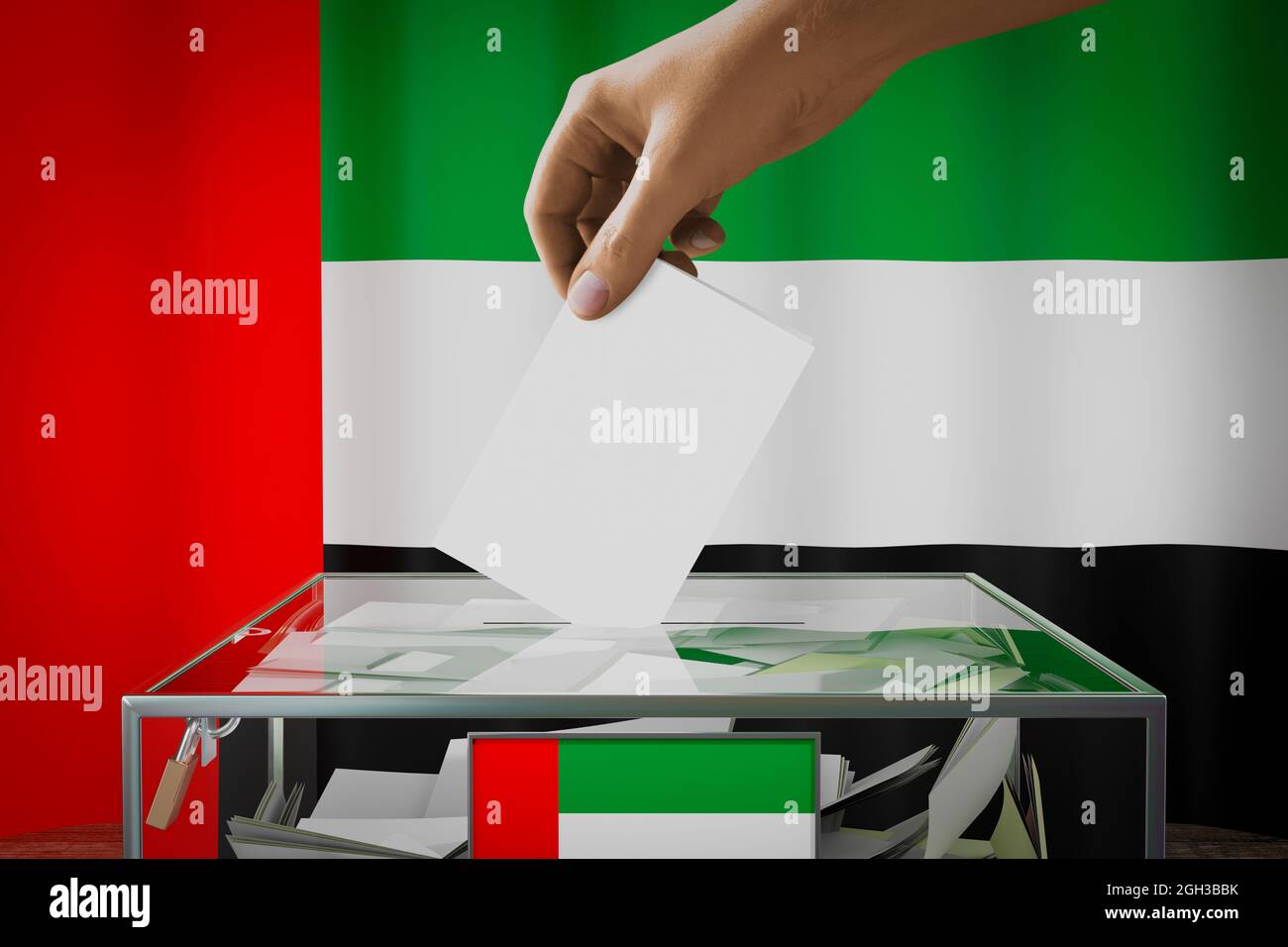 United Arab Emirates flag, hand dropping ballot card into a box ...
