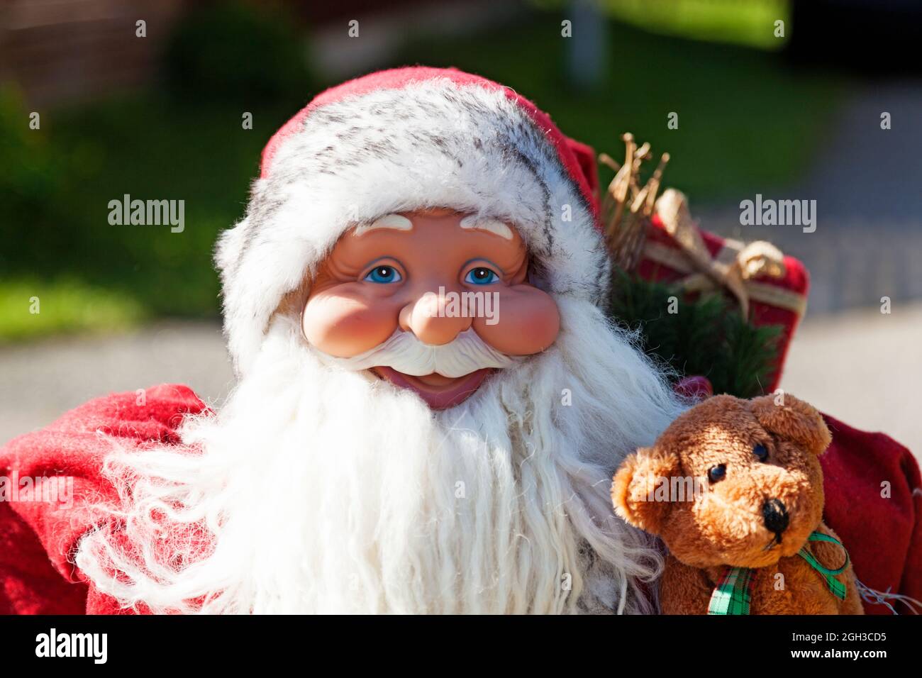 a large Santa doll on display in the middle of summer Stock Photo - Alamy