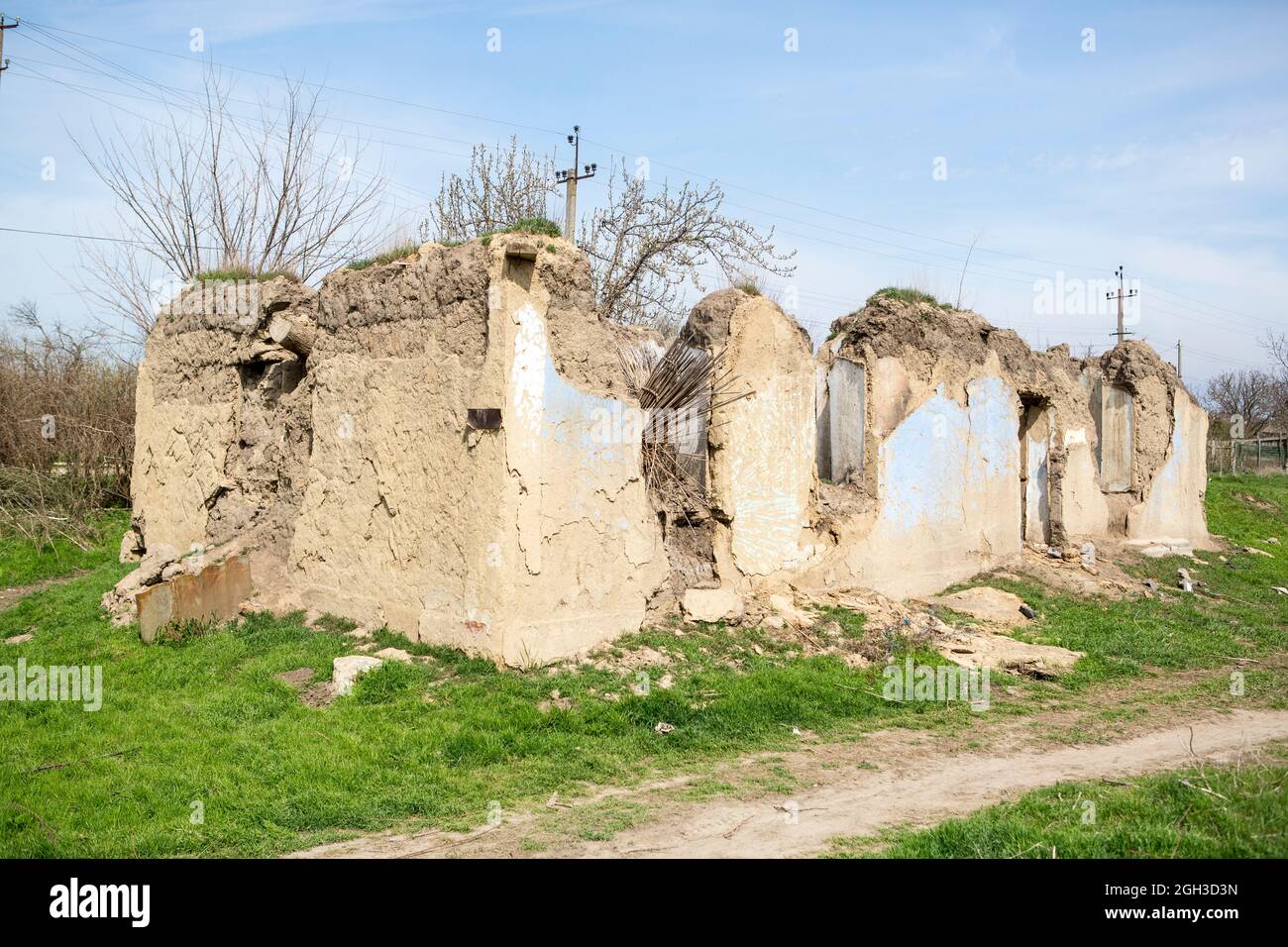 Ruined old house. Ruins of a house made of shell rock, straw and clay ...