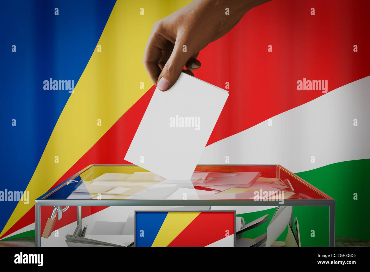 Seychelles flag, hand dropping ballot card into a box - voting ...
