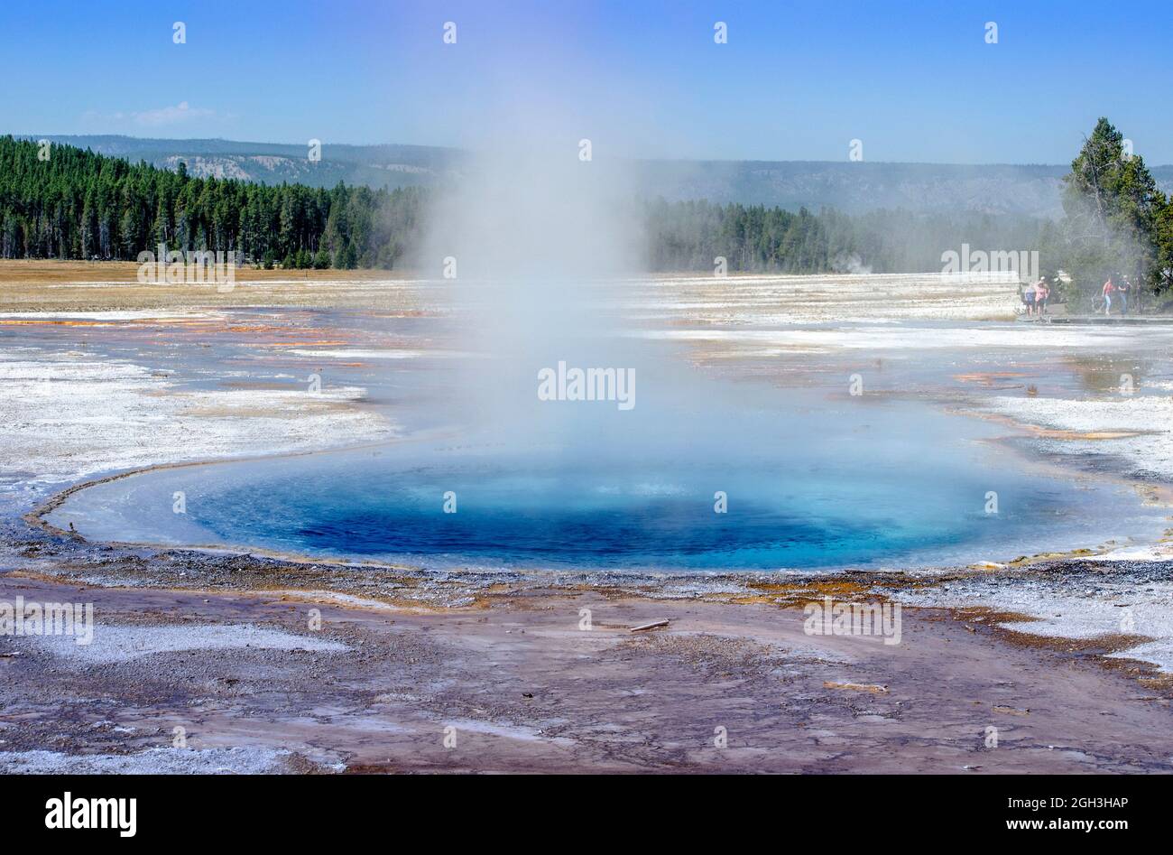 deep blue thermal pool in Yellowstone national park looks like a ...