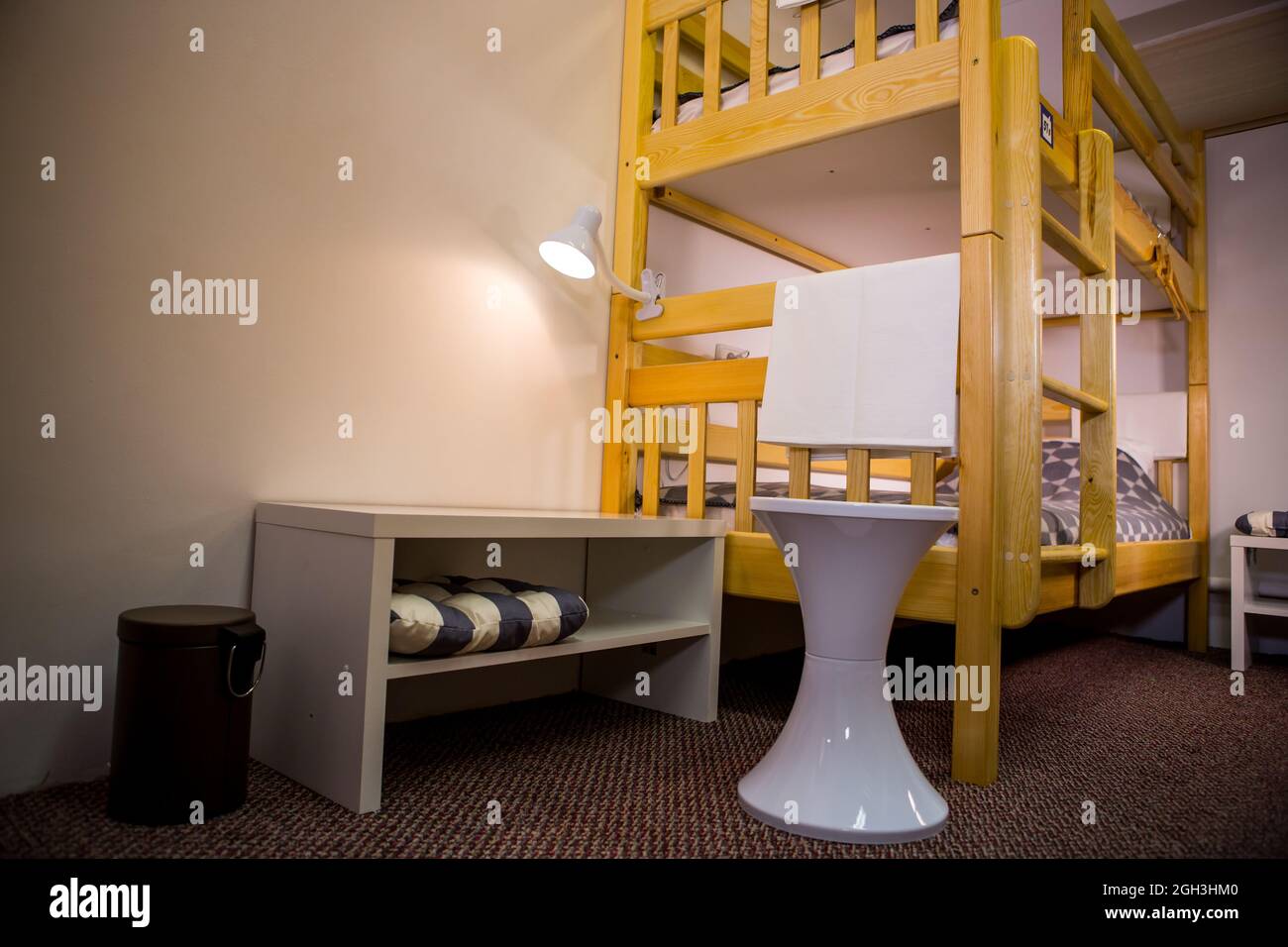 Interior of the hostel bedroom. Hostel with wooden bunk beds Stock ...