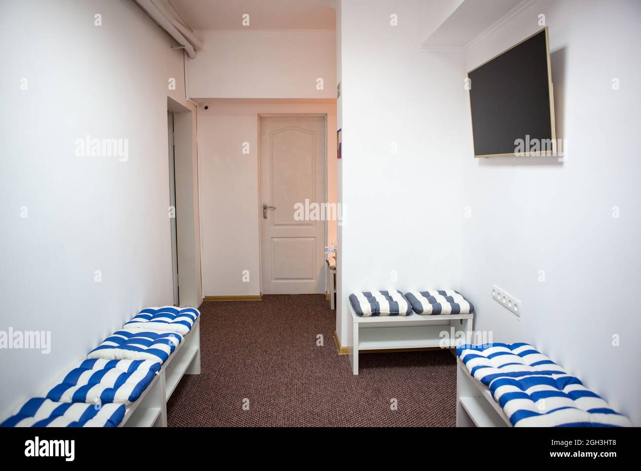 Hall with many doors Stock Photo - Alamy