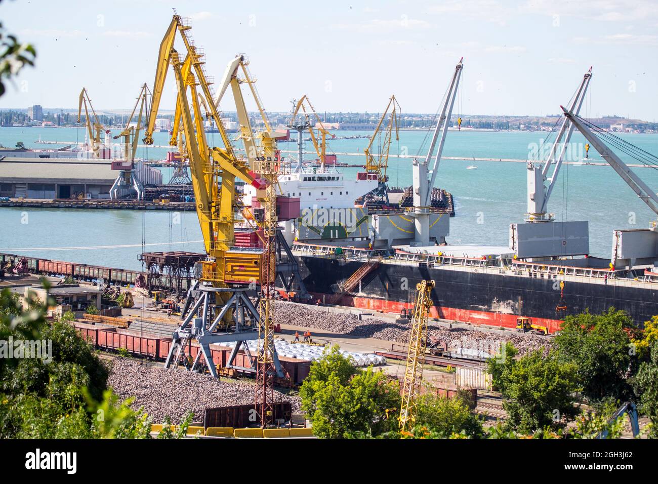 Ship dry cargo in port for loading grain. Vessel bulk carrier loading ...