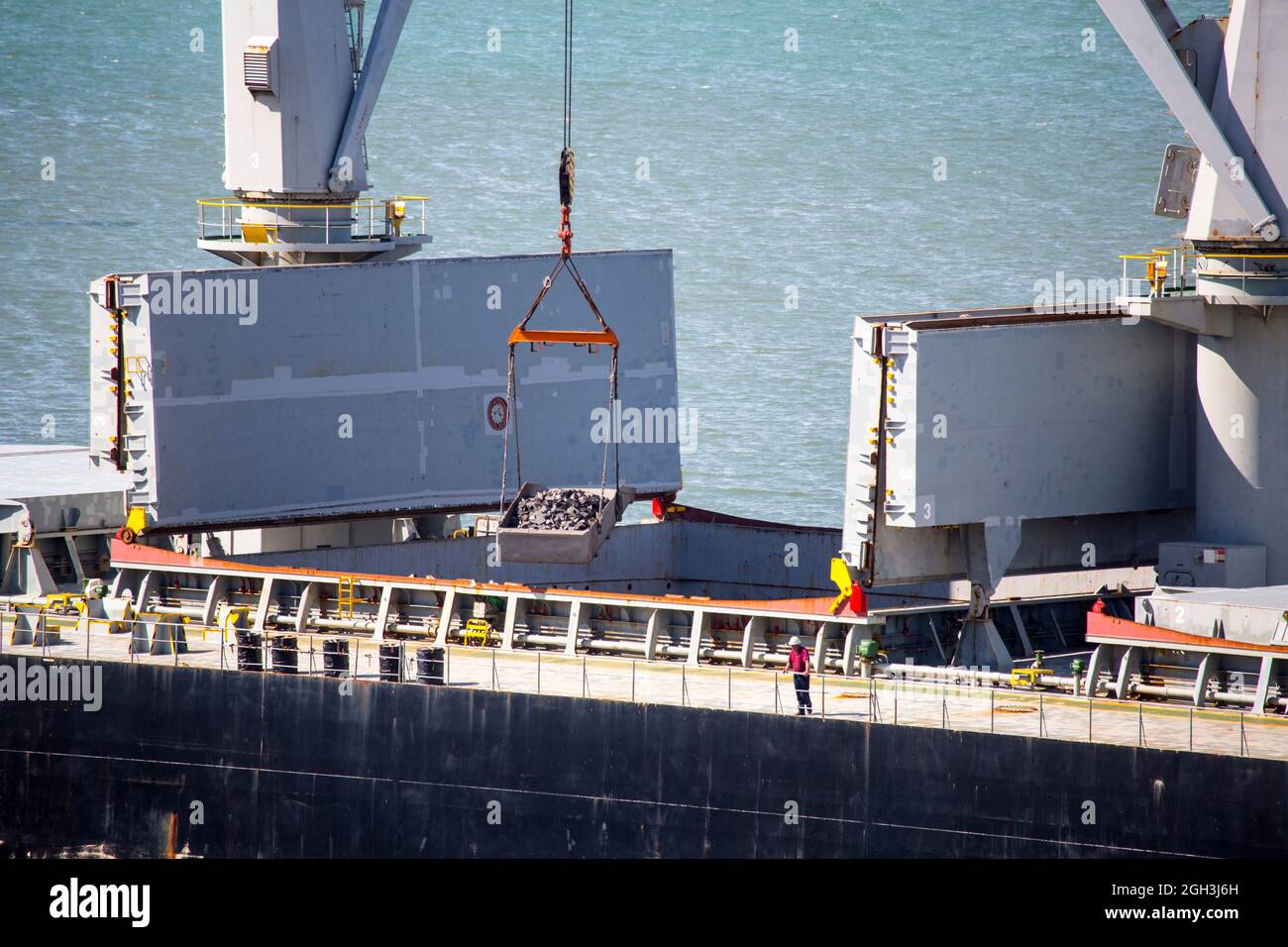 Vessel dry cargo on loading by iron ore, unloading in port. Bulker in ...