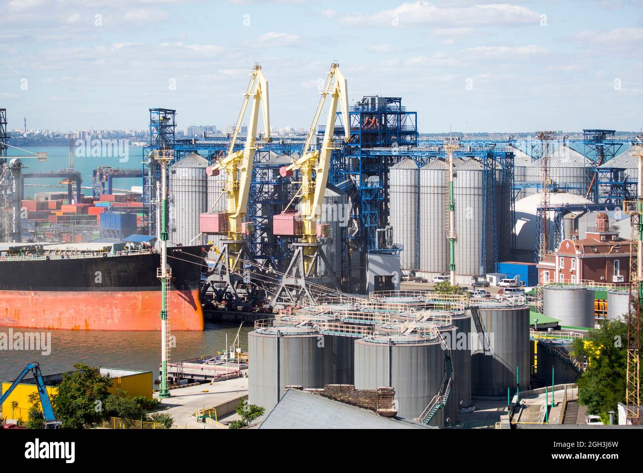 Port grain elevator. Industrial sea trading port bulk cargo zone grain ...
