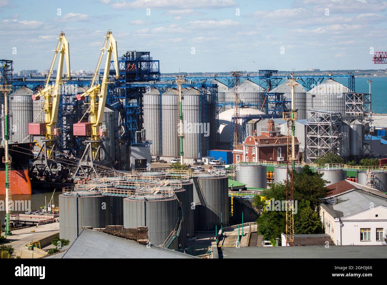 Port grain elevator. Industrial sea trading port bulk cargo zone grain ...