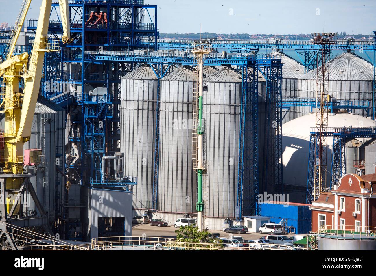 Port grain elevator. Industrial sea trading port bulk cargo zone grain ...