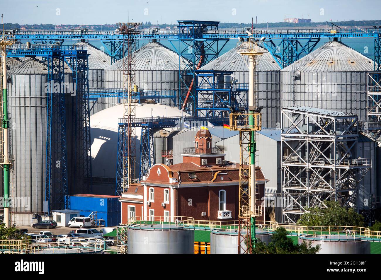 Port grain elevator. Industrial sea trading port bulk cargo zone grain ...
