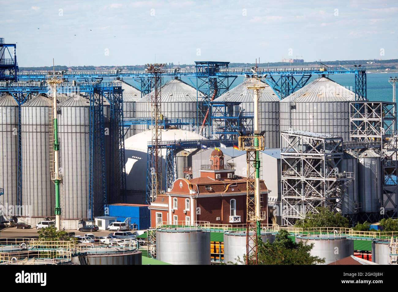 Port grain elevator. Industrial sea trading port bulk cargo zone grain ...