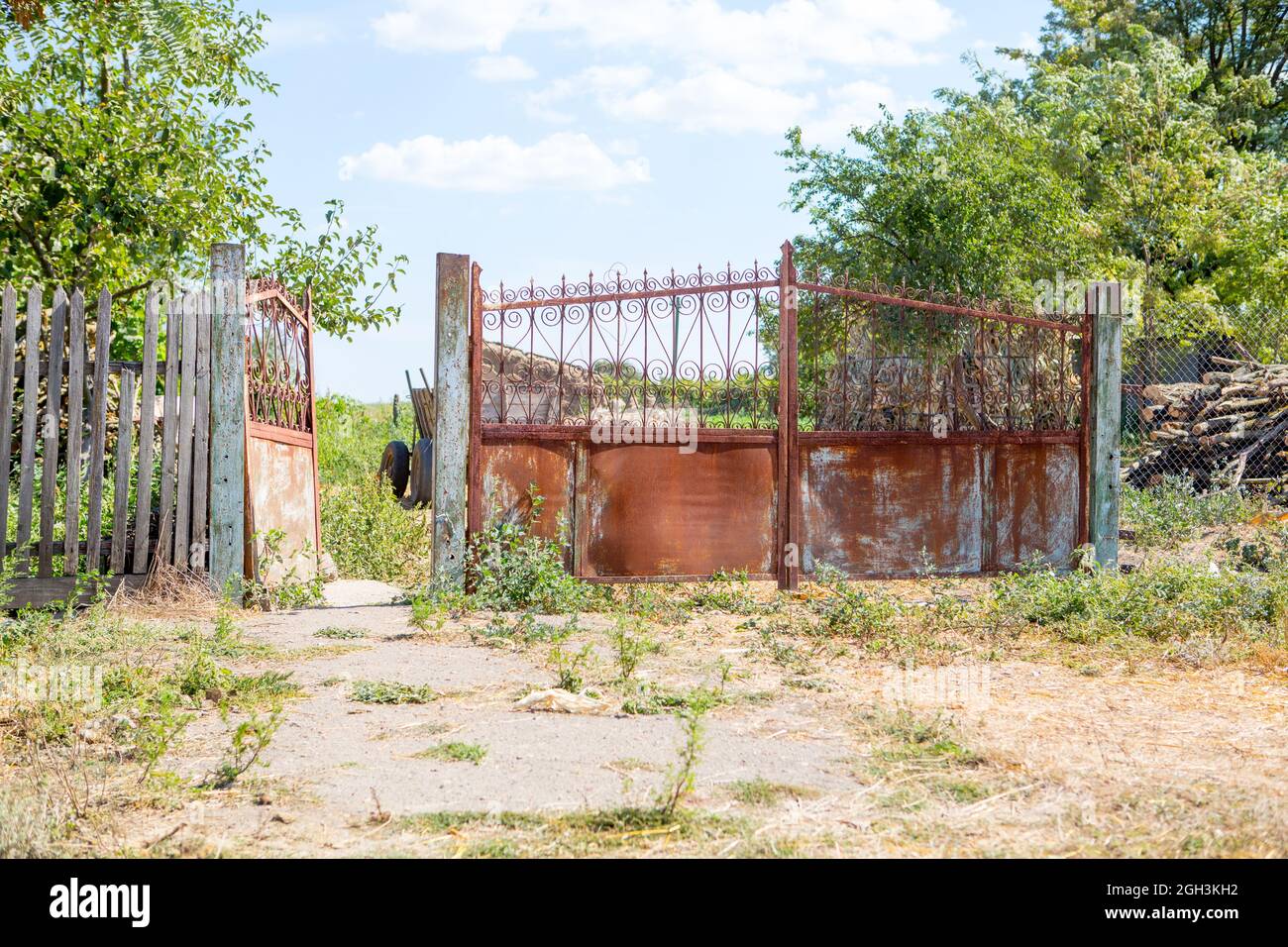 old rickety gates. Old rusty gate in an abandoned house. Broken gate ...