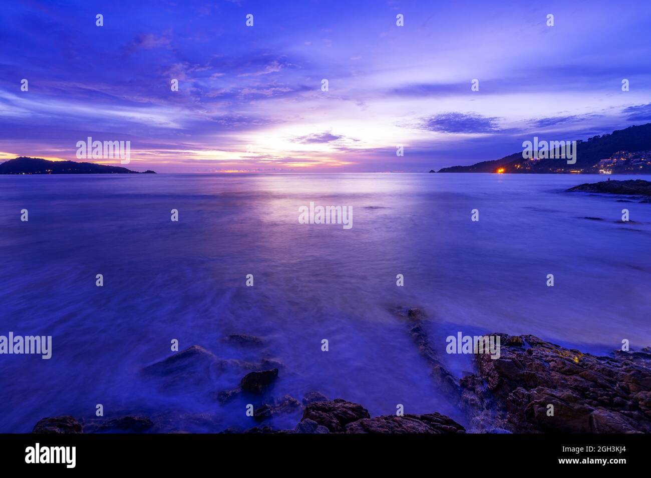 Long exposure image of Dramatic sky seascape with rock in sunset ...